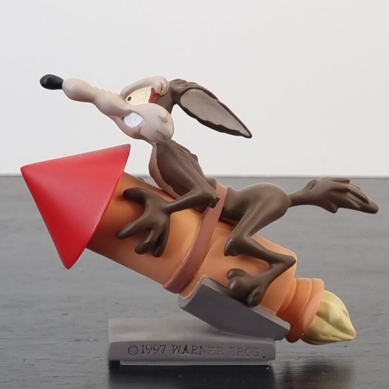 Vintage Wile E Coyote figurine on a rocket - Looney Tunes